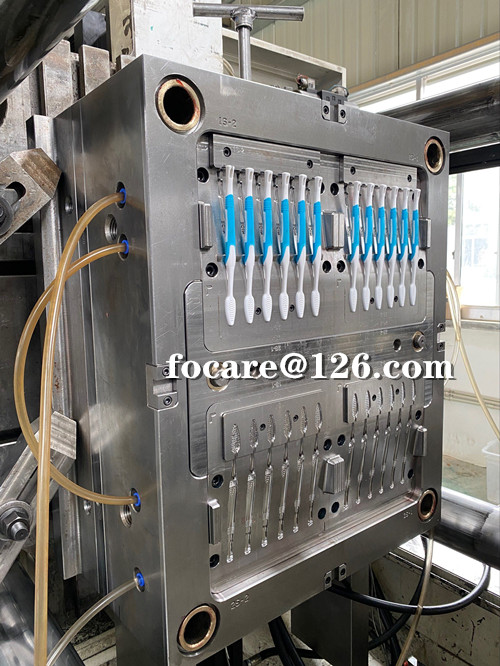 Two component multi cavity toothbrush mold with rotary shaft design ...